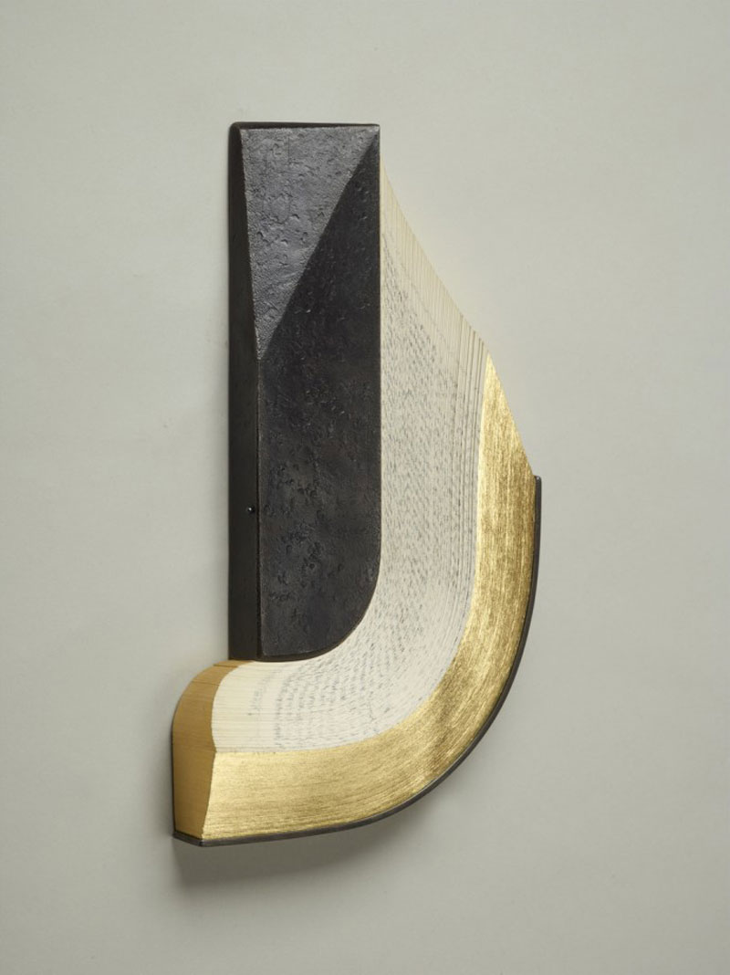 Stunning book sculptures shaped with metal